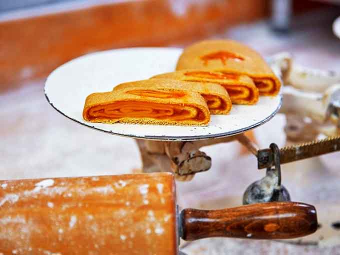Apricot kolachi rolls showcase the perfect spiral, where tangy fruit meets buttery dough in a dance of complementary flavors.