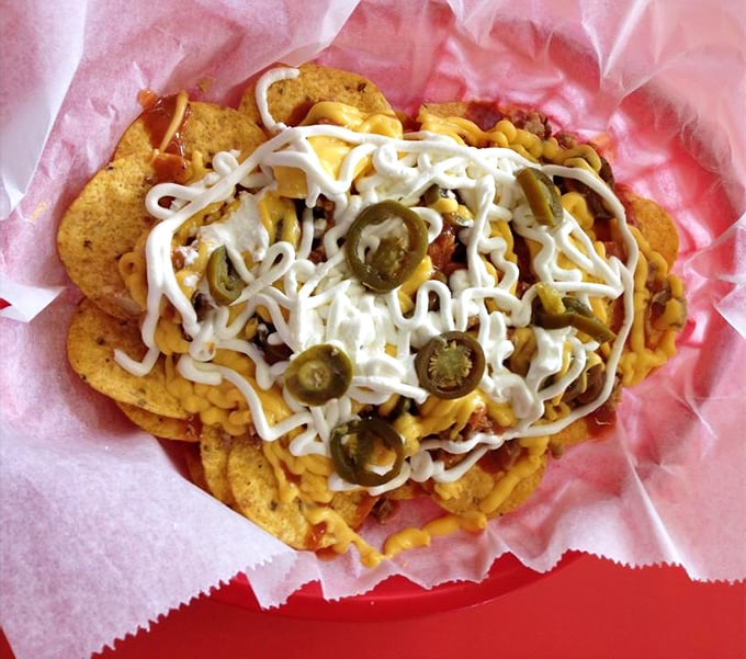 Loaded nachos that laugh in the face of moderation &ndash; a mountain of chips, cheese, jalape&ntilde;os and toppings that demands to be shared.