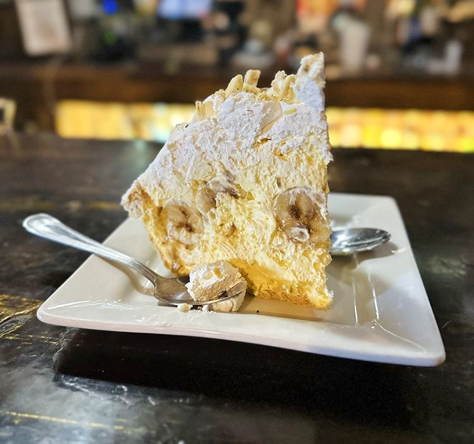 Cloud-like banana cream pie that somehow finds room in stomachs already filled with hearty main courses – dessert magic at work.