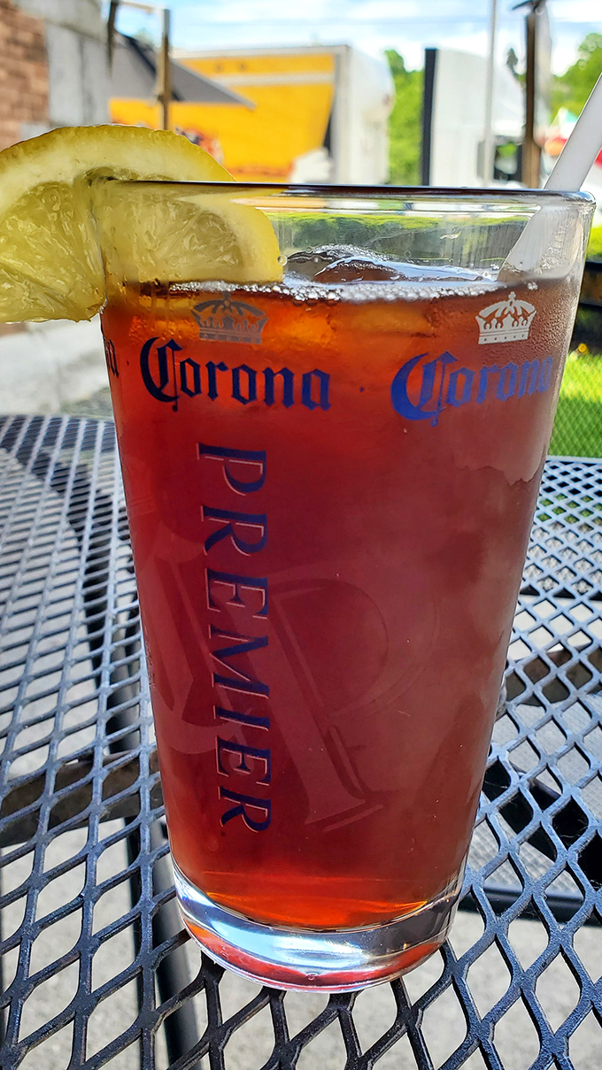 This isn't just iced tea &ndash; it's a ruby-red refresher served in a proper pint glass with a lemon wedge, perfect for washing down whatever deliciousness you've ordered.