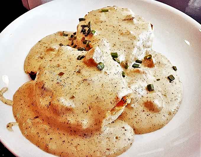 Southern comfort comes north in these biscuits and gravy &ndash; fluffy clouds of dough swimming in peppery, sausage-studded gravy.