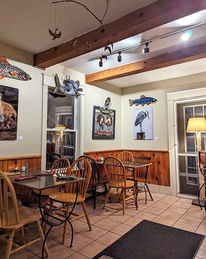 Mismatched chairs, warm lighting, and local artwork create a dining room where everyone feels like a regular, even on their first visit.