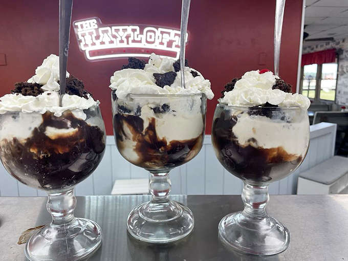 Three Brownie Buckets lined up like delicious soldiers &ndash; proof that sometimes the best things in life come in take-home containers.