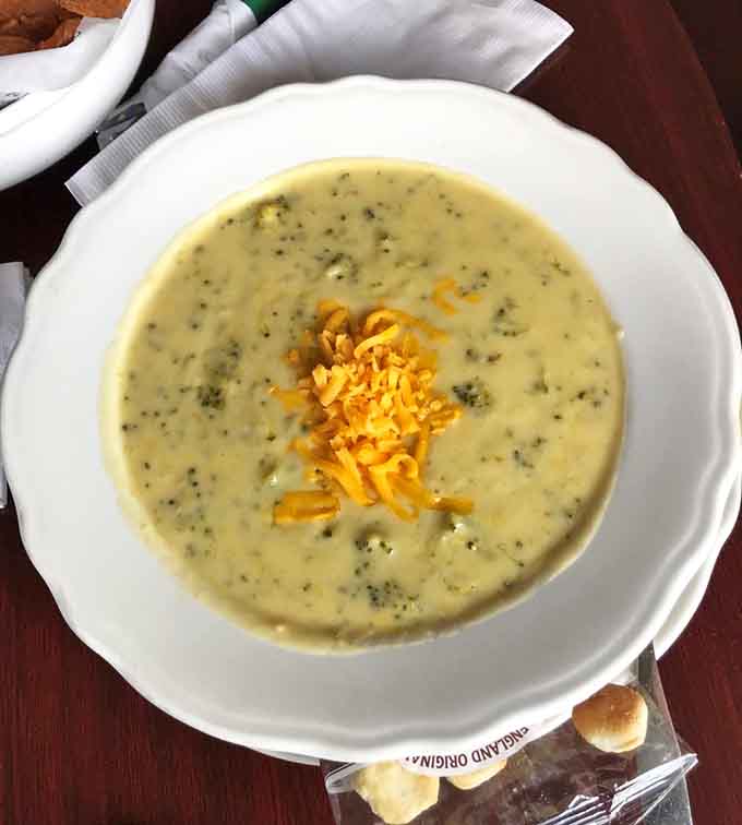 Creamy broccoli cheddar soup topped with melted cheese warms you from the inside out on chilly days.