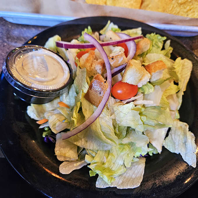 Even the greens get special treatment – crisp lettuce, fresh veggies, and homemade dressing prove salads don't have to be punishment.