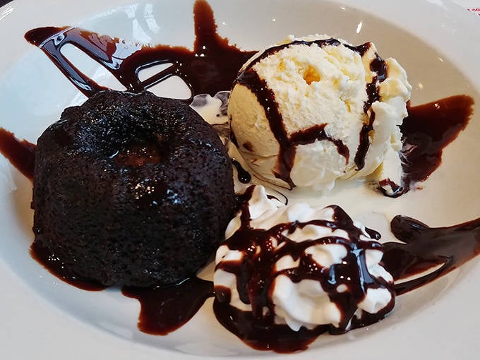 Warm chocolate cake with a molten center that flows like sweet crude oil, paired with cool vanilla ice cream&mdash;dessert engineering at its finest.