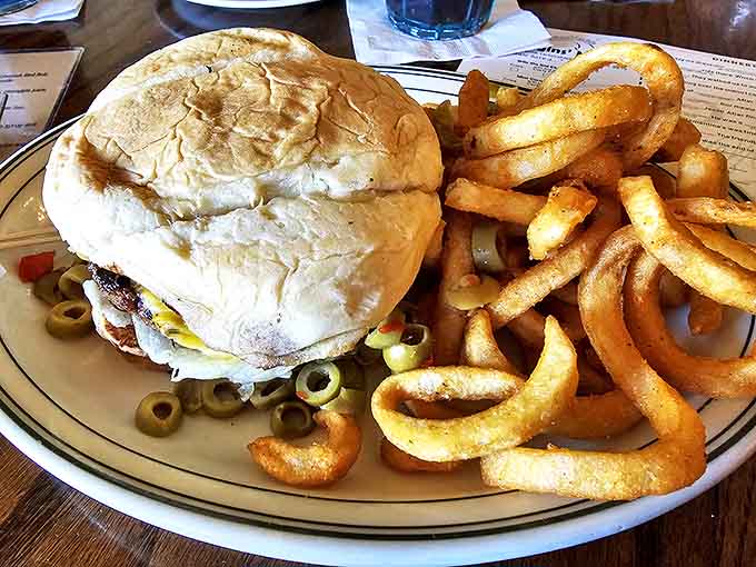 This towering achievement of beef, bun, and toppings requires both strategy and commitment to conquer, but rewards the brave with every juicy bite.