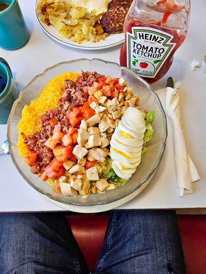 A Cobb salad arranged with military precision &ndash; each ingredient standing at attention, ready to report for delicious duty.