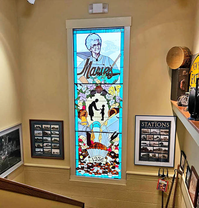 The stunning stained glass window tells Marie's story in vibrant color, a sweet tribute to the shop's heritage and the joy it brings.