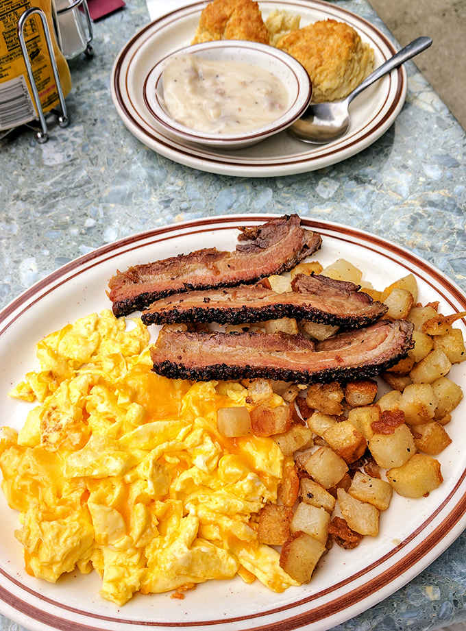 Morning glory on a plate&mdash;golden eggs, home fries with crispy edges, and bacon with that perfect bend that signals ideal crispness.