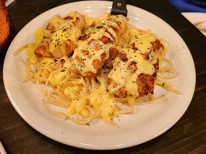Tender chicken meets creamy Alfredo sauce in a pasta dish that delivers comfort food at its absolute finest.