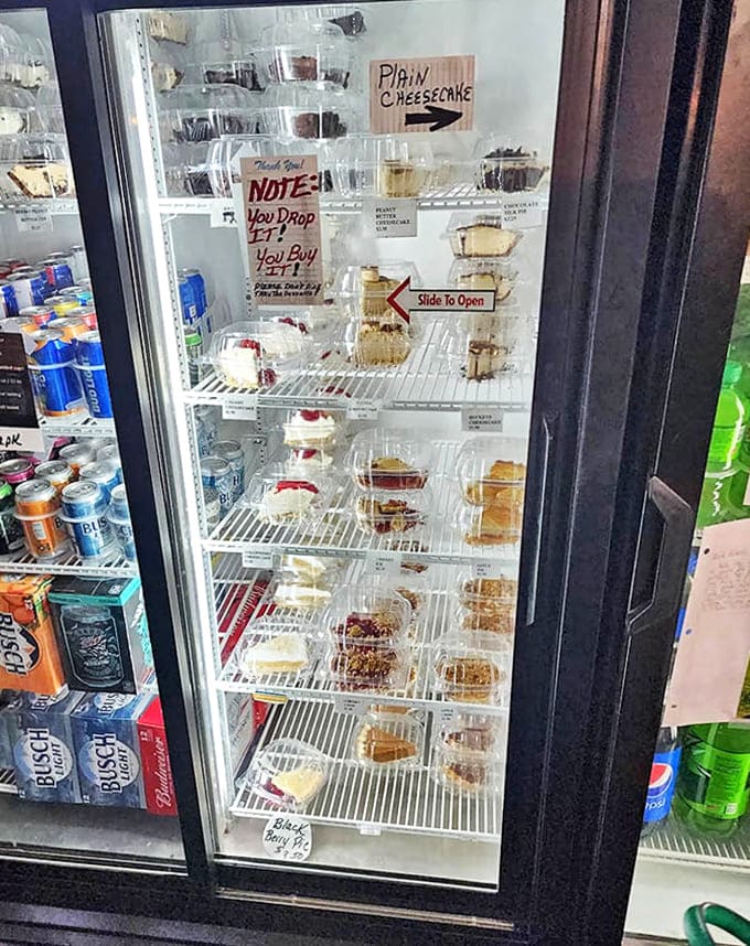 Sweet temptations await behind glass, with a charmingly direct warning about handling. Life's too short to skip dessert, especially these homemade treasures!