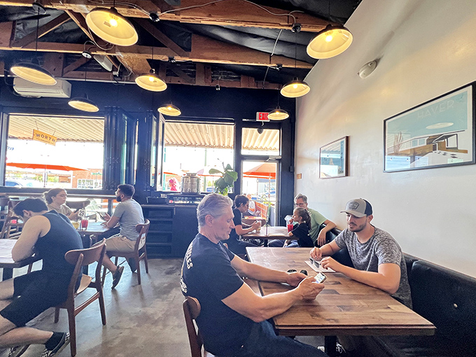 The communal joy of breaking bread together &ndash; patrons engage in the serious business of sandwich appreciation at Worth's welcoming tables.