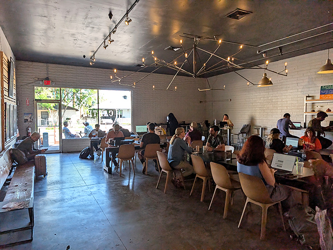 The community workspace buzzes with productivity and conversation &ndash; a testament to Cartel's role as Tempe's living room.