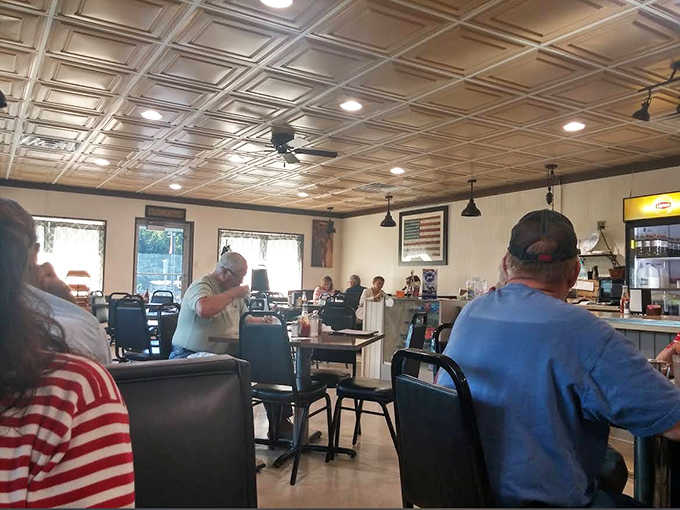 The dining room hums with conversation as regulars and newcomers alike bond over the universal language of exceptional comfort food.