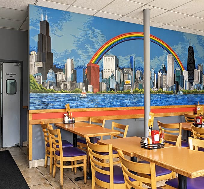 Dining Area: Exposed brick walls showcase colorful pop art that gives Stella's its unique personality &ndash; part retro diner, part neighborhood art gallery.