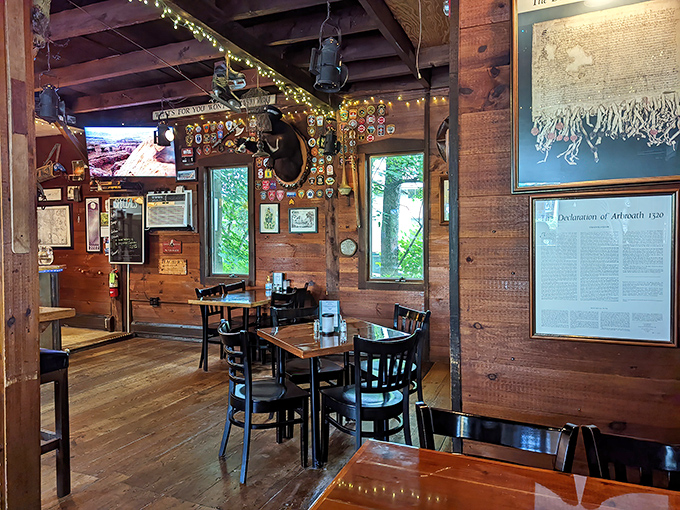 The rustic wooden interior creates a cozy atmosphere where conversation flows as freely as the drinks from behind the well-stocked bar.
