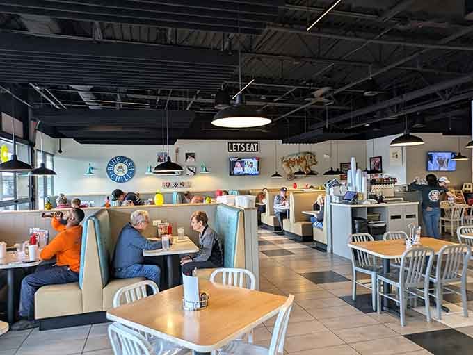 The dining room buzzes with conversation and laughter &ndash; a community gathering spot where food brings everyone together.