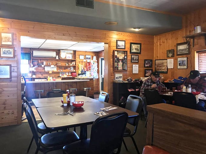 Knotty pine walls embrace diners like a warm hug while vintage photographs stand guard over countless coffee refills and satisfied sighs.