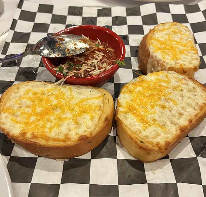 Texas toast cheese bread arrives like edible comfort, perfect for those who believe bread needs more bread.