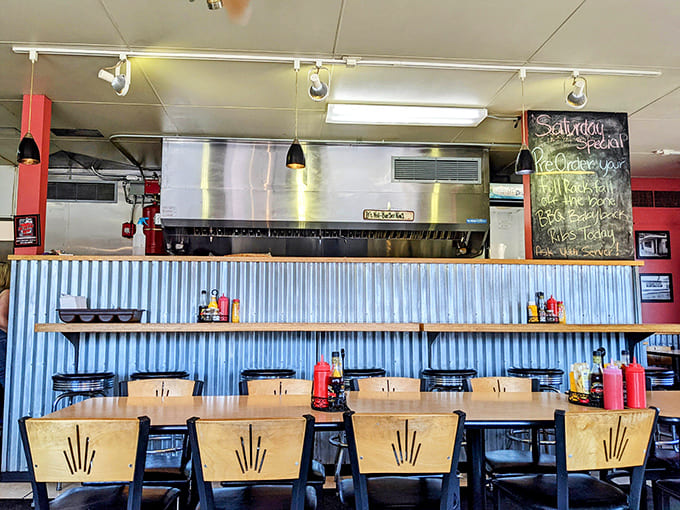 Vintage-inspired seating and corrugated metal walls create an atmosphere that's both nostalgic and inviting for modern diners.
