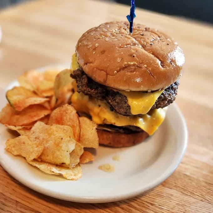 This double cheeseburger doesn't need fancy toppings or artisanal buns &ndash; just honest beef, melty cheese, and house-made chips for the win.