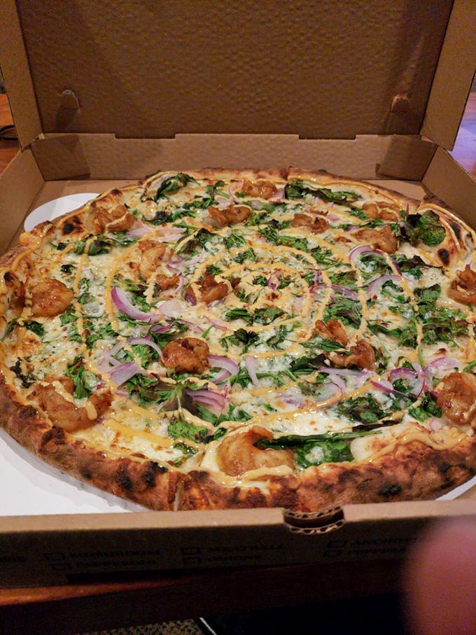 Succulent shrimp, spicy kick, and cooling greens &ndash; this pizza balances flavors like a culinary tightrope walker.