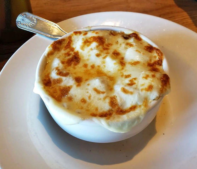 French onion soup with that perfect cheese pull that makes you want to tag everyone you know on social media.
