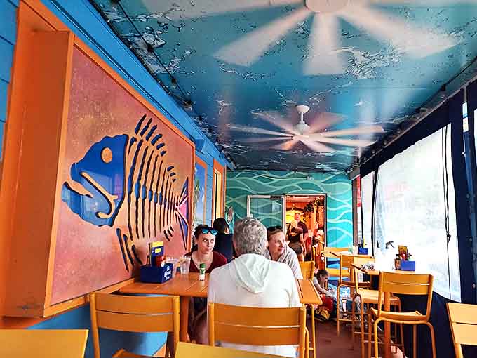 The underwater-themed dining room, complete with fish murals and blue ceilings, makes you feel like you're dining beneath the waves you're eating from.