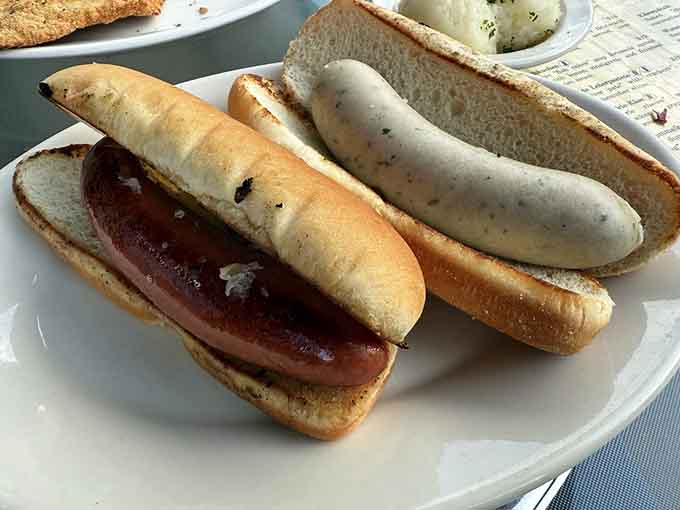 Knackwurst and weisswurst sitting pretty on a plate, ready to show you what authentic German sausages taste like.