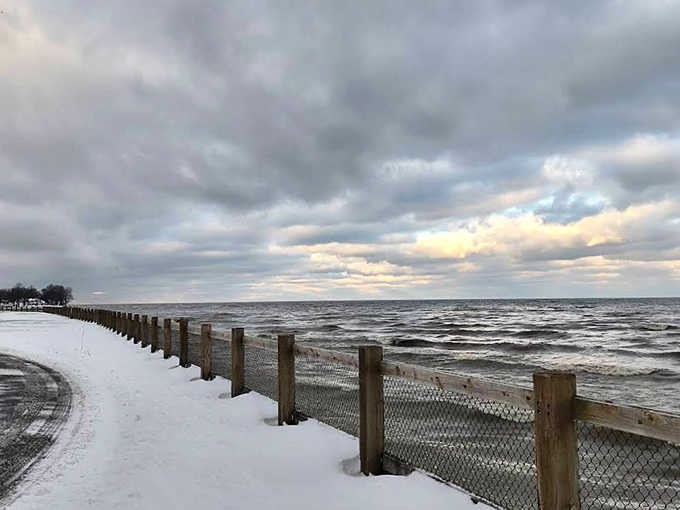 Winter's quiet magic transforms Geneva State Park into a snow-globe wonderland where footprints tell stories of solitary adventures.