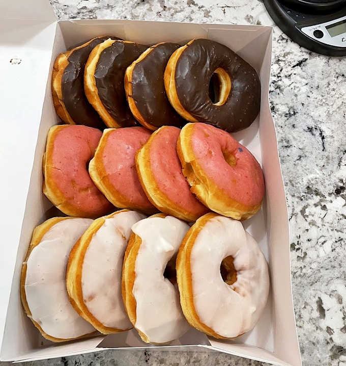 Glazed donuts glistening like they've been touched by King Midas &ndash; simple, classic, and absolutely perfect in their golden glory.