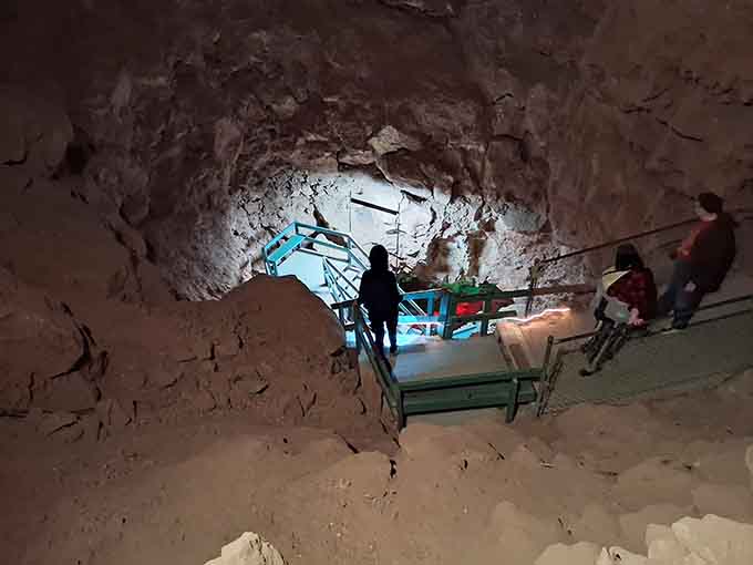 Visitors descend into the depths, about to discover why some adventures require going down instead of up.