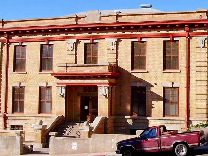 Clifton's historic courthouse stands proudly in brick-red splendor, a testament to times when civic architecture made bold statements.