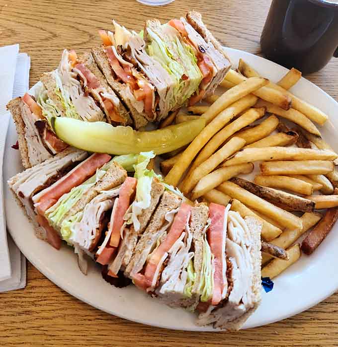 This club sandwich is stacked higher than most people's ambitions, loaded with turkey, bacon, and all the fixings your heart desires.