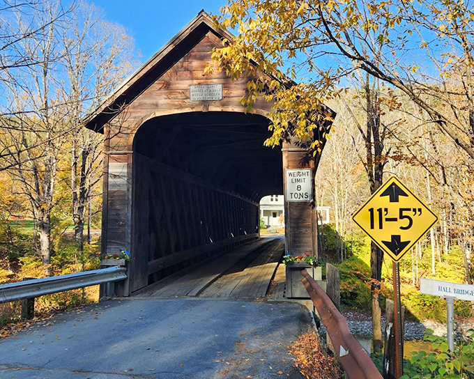 The Hall Covered Bridge stands as a testament to Vermont's classic New England charm and engineering heritage.