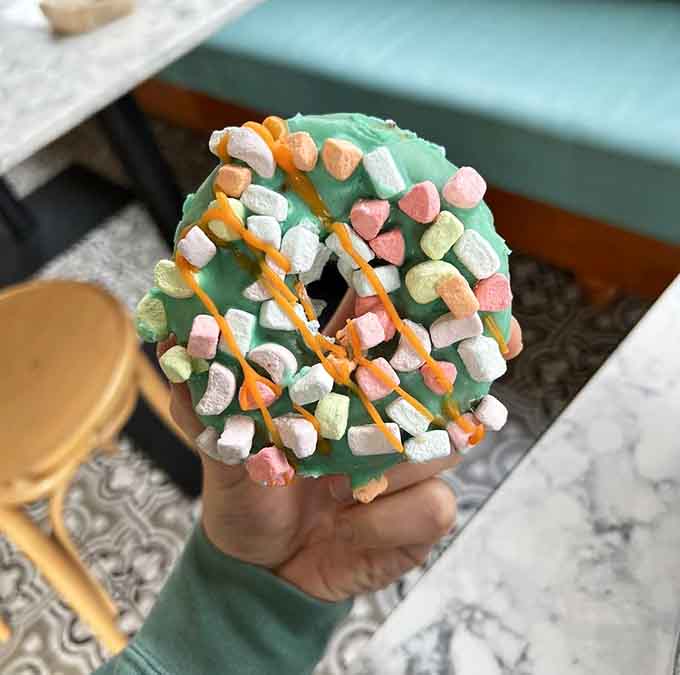 Lucky Charms on a donut proves that childhood dreams and adult breakfast can absolutely coexist in delicious harmony.