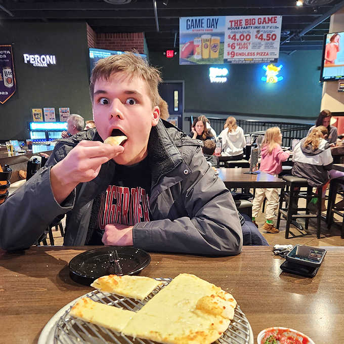 The restaurant buzzes with energy as patrons enjoy that universal language of good food in a welcoming atmosphere.