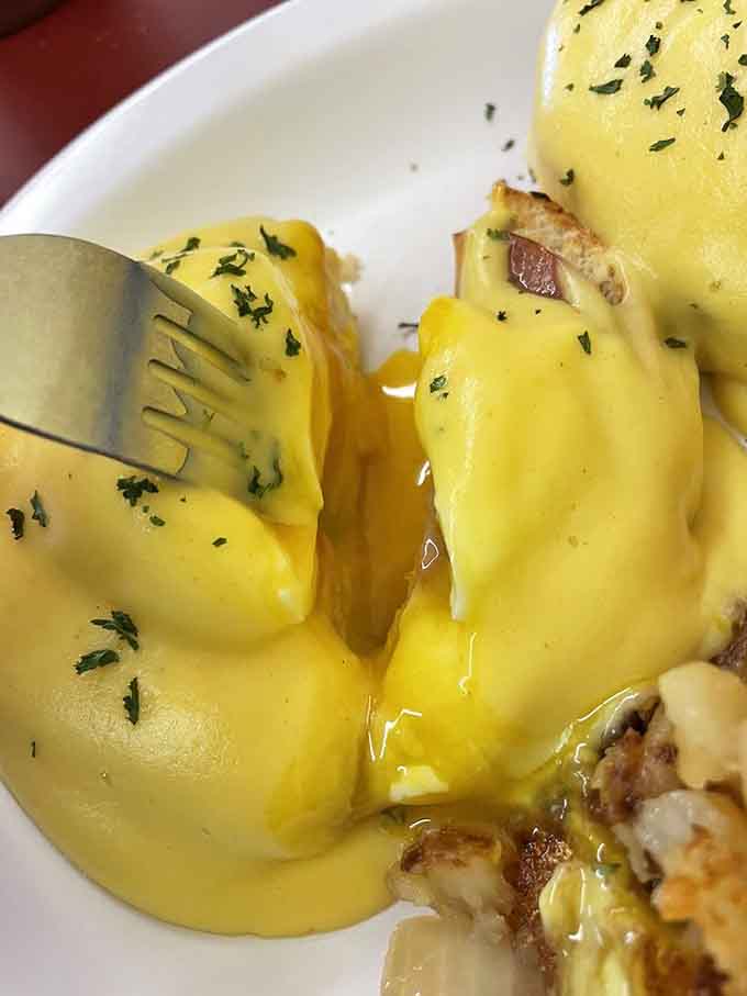 Eggs Benedict done right, with hollandaise that's tangy and rich, proving some classics can't be improved upon, only perfected.