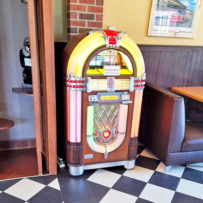 The vintage jukebox stands ready to provide the soundtrack to your meal – no playlists needed when you've got decades of hits at your fingertips.