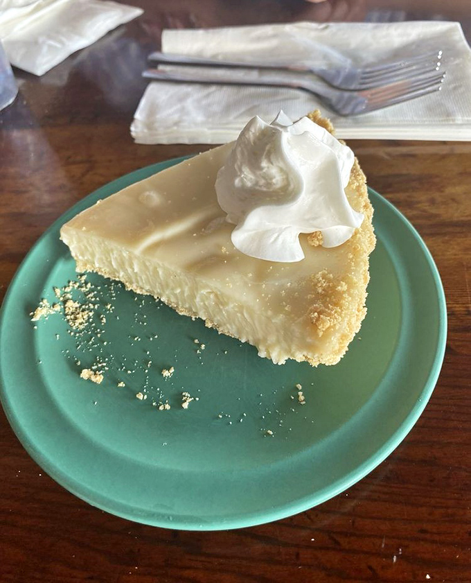 Key lime pie done right &ndash; the perfect sweet-tart balance with a dollop of whipped cream atop a graham cracker crust.
