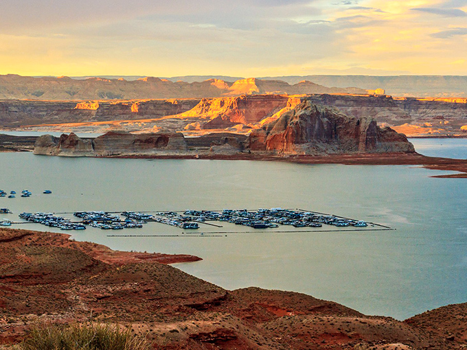 Lake Powell's turquoise waters create a stunning contrast against the red rock formations, nature's own version of a perfect color palette.