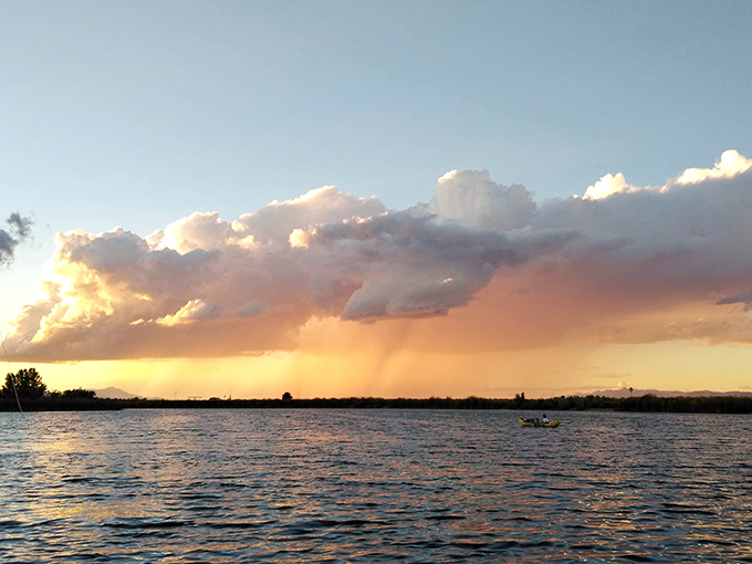 The lake's crystal waters reflect clouds and mountains, creating twice the scenery for half the effort of looking around.