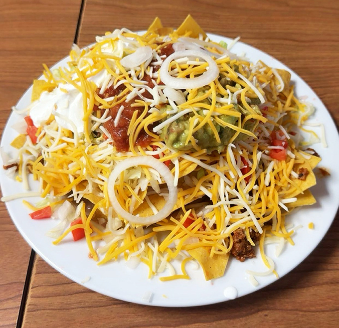 These loaded nachos aren't just a meal, they're an architectural achievement &ndash; a mountain of crispy chips supporting the weight of multiple toppings.