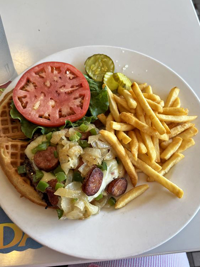 The Louisiana Waffle Burger laughs in the face of convention – why use bread when waffles exist? Sausage and beef create a magnificent meat duet.