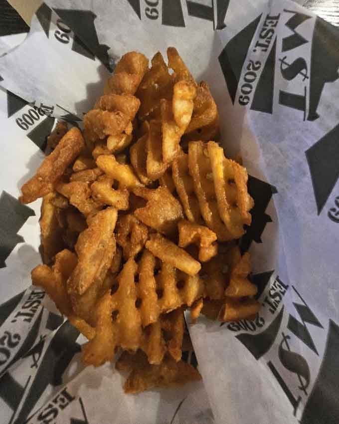 Waffle fries with special seasoning that'll have you fighting over the last crispy piece at your table.
