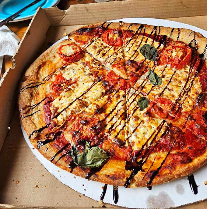 Pizza perfection &ndash; this margherita masterpiece with its balsamic drizzle pairs beautifully with both wine and beer flights.