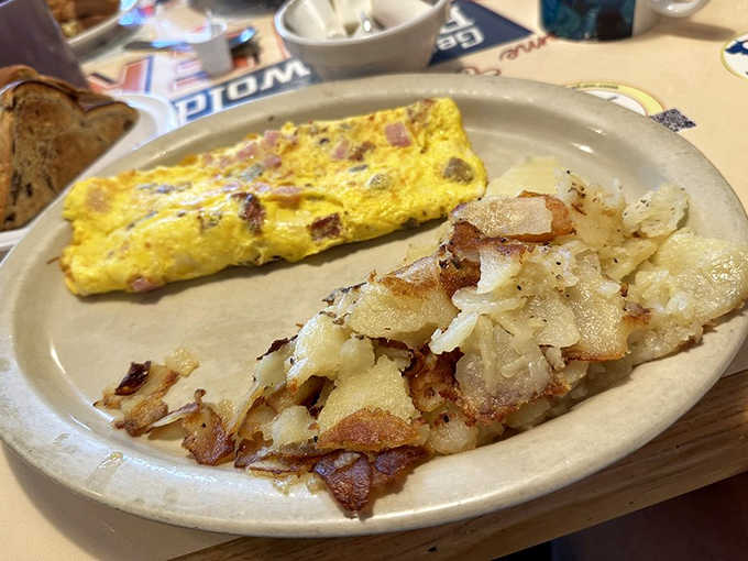 This meat lover's omelet doesn't just contain ham &ndash; it celebrates it, folded into fluffy eggs alongside potatoes that have achieved the perfect crisp-tender balance.