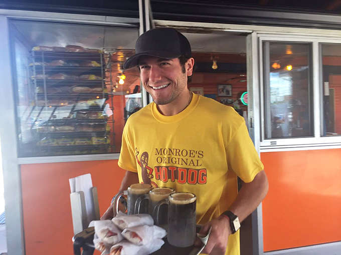 The friendly face of tradition – Monroe's staff continues the legacy of hospitality and hot dog craftsmanship that keeps generations coming back.