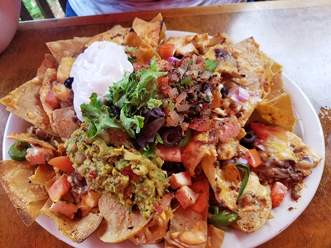 Nacho mountain expedition required &ndash; layers of crispy chips, melted cheese, and fresh toppings create a shareable fiesta for the table.